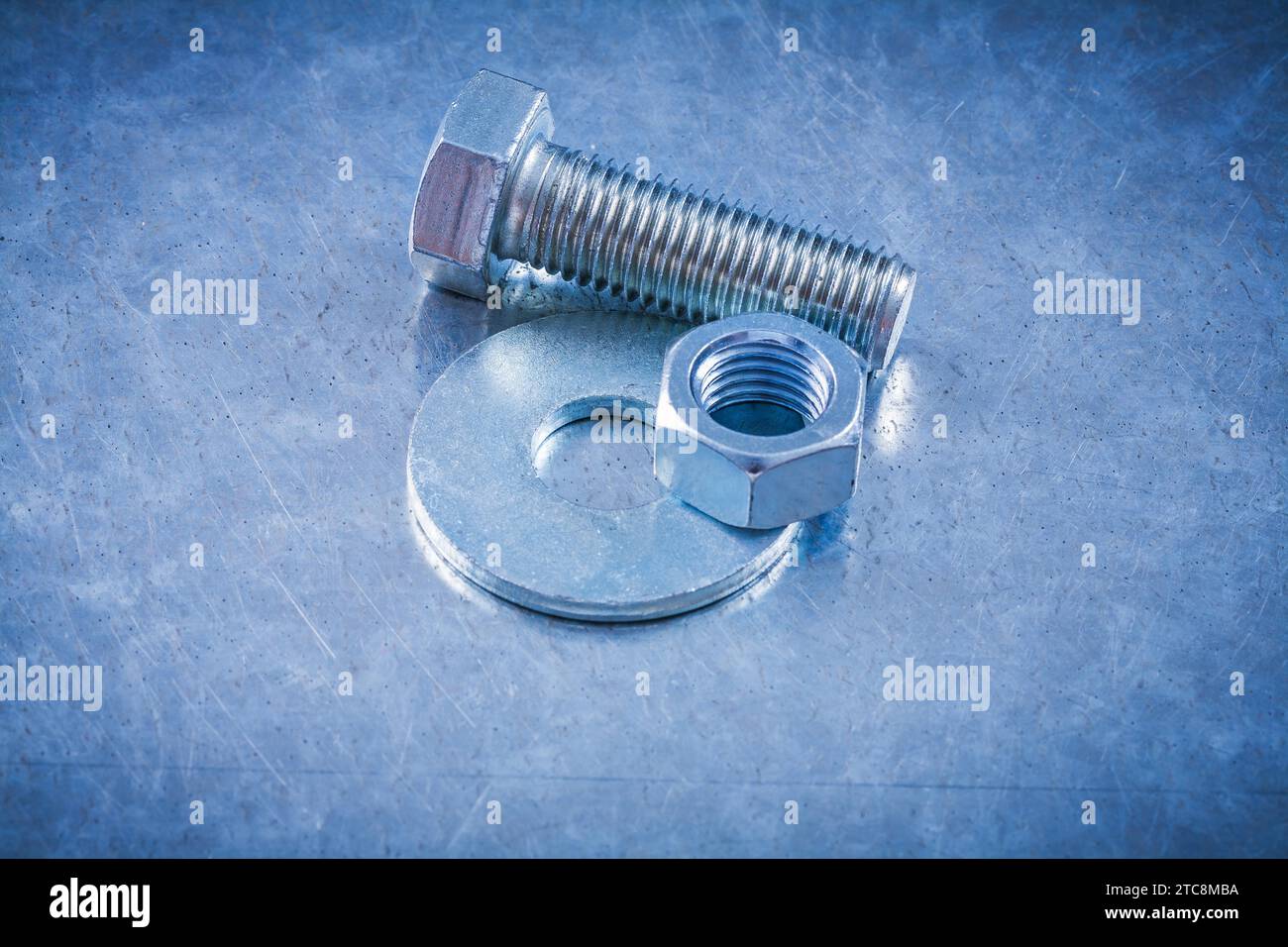 Stainless screwbolt bolt washer and screw-nut on metallic surface Stock ...