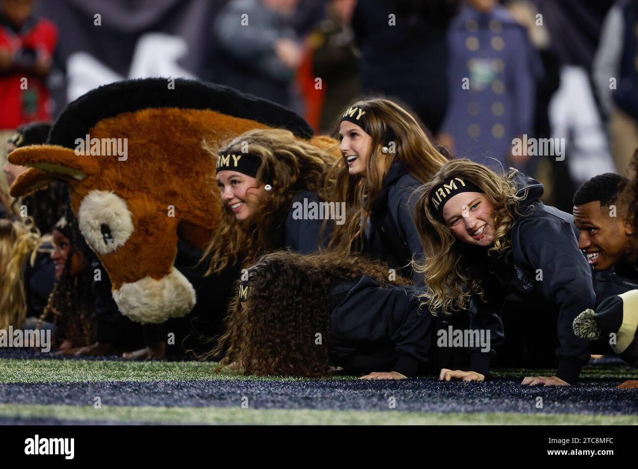 Army cheerleaders do pushups after a score against the Navy Midshipmen ...
