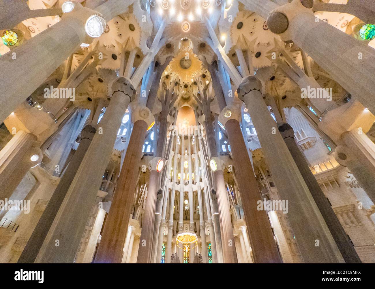 Light floods through the stained glass windows of the basilica de la ...
