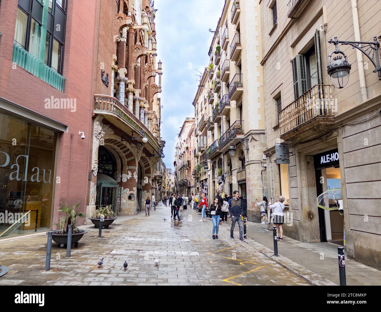 Barcelona, Spain - August 27, 2023: Tourists walk the streets among the ...