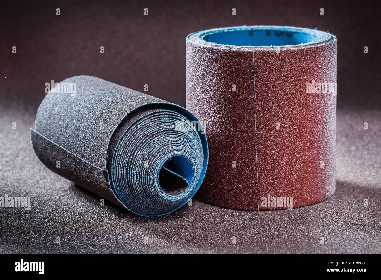 Two big rolls of sand paper on abrasive background Stock Photo - Alamy