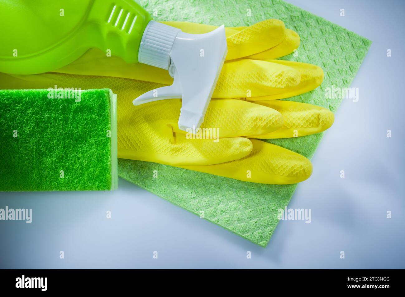 Cleaning dishrag sponge sprayer safety gloves on white surface Stock ...