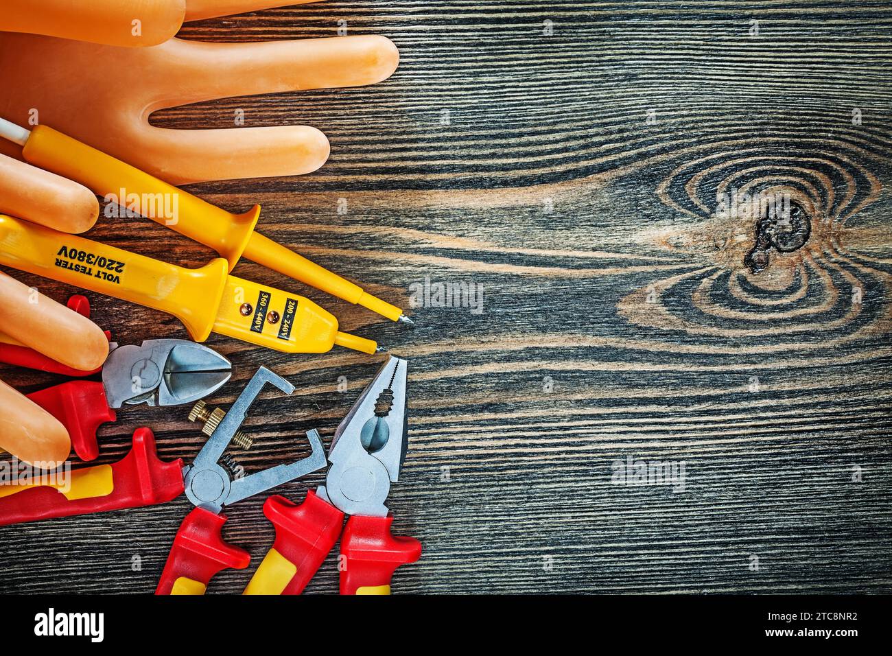 Composition of insulating electric tools on wooden board Stock Photo ...