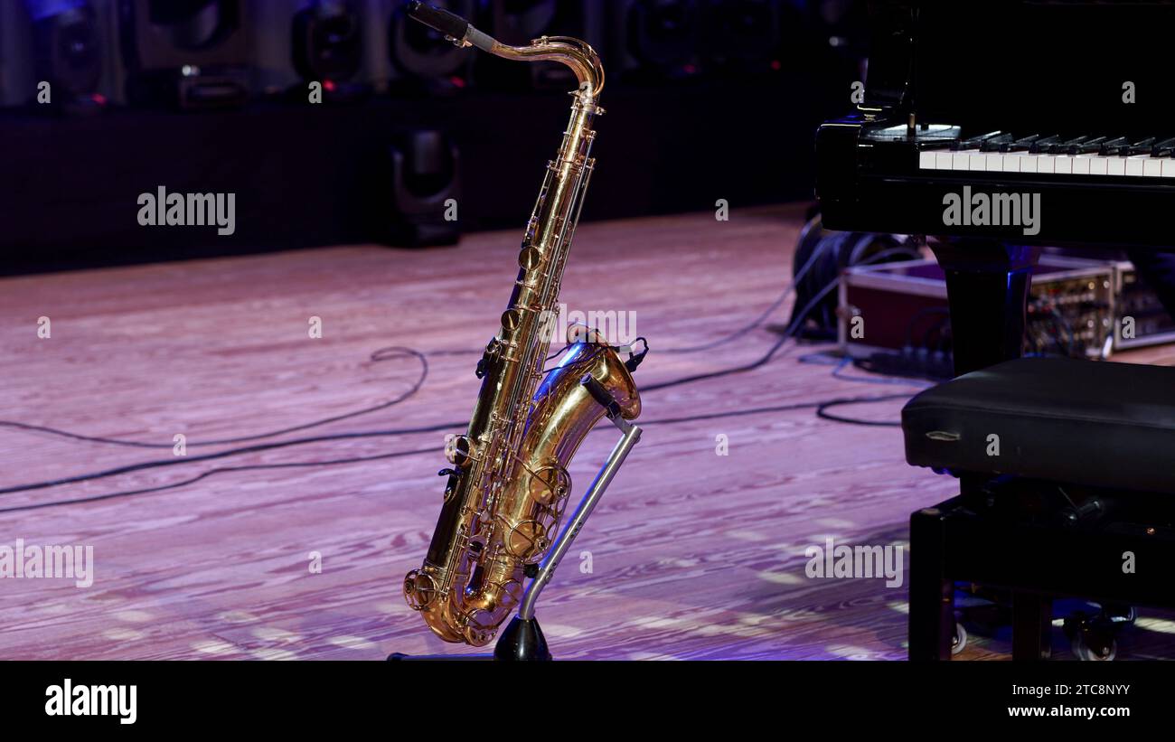 Saxophone on the stage of a town hall Stock Photo - Alamy