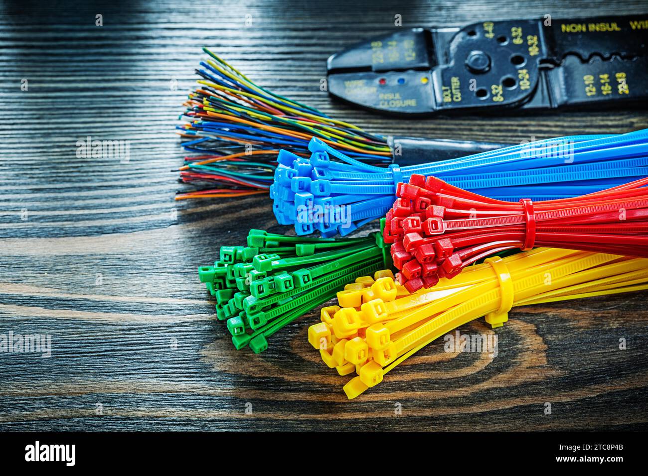 Electric wires tying cables bolt cutter on wooden board Stock Photo - Alamy