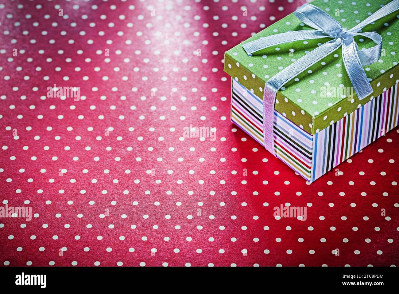 Gift box on red textile top view celebrations concept Stock Photo - Alamy