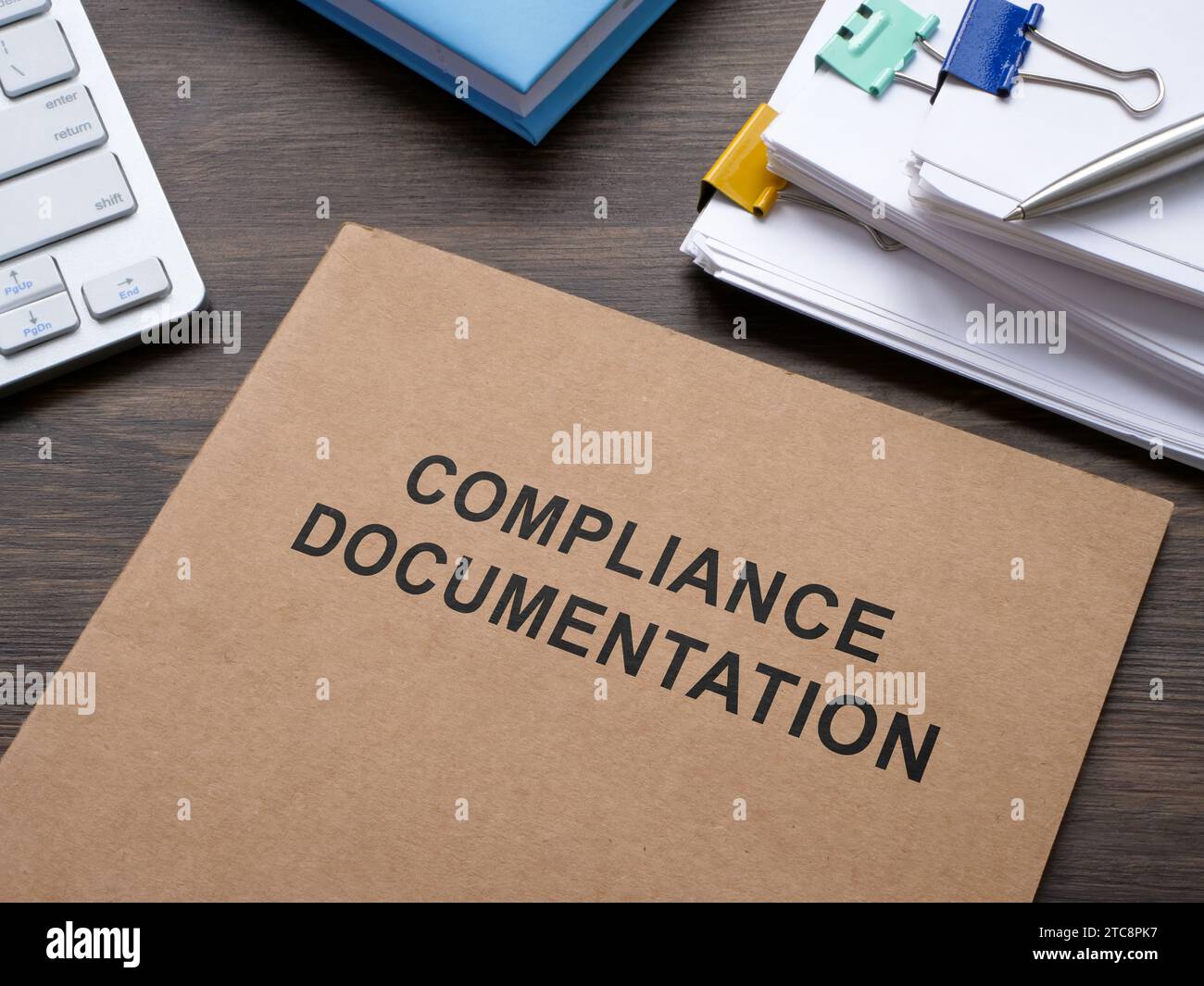 Compliance documentation on the desk Stock Photo - Alamy