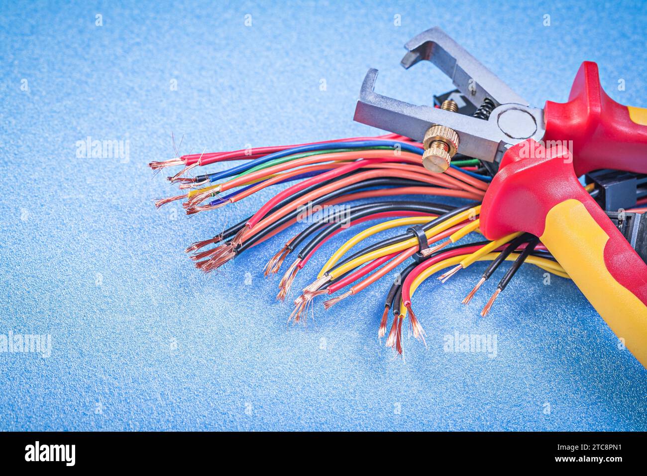 Insulated wire strippers set of electric cables on blue background ...