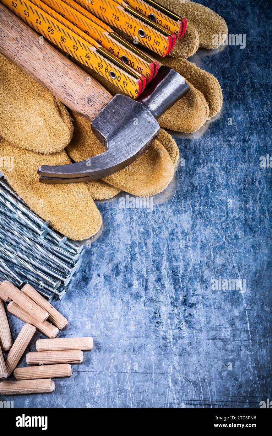 Hammer leather protective gloves wooden meter stack of metal nails and ...