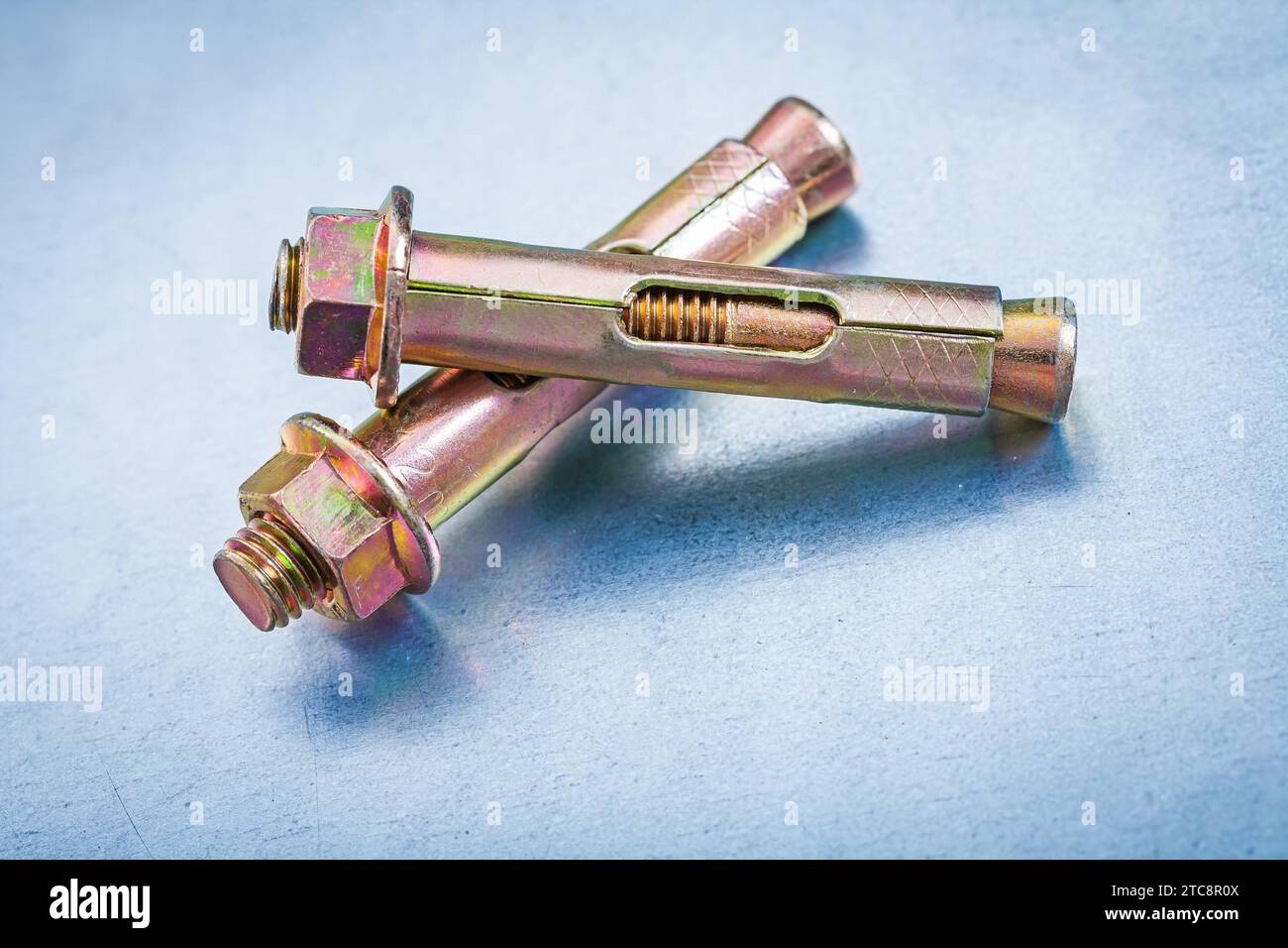 Pair of metal anchor bolts for concrete walls and on metallic ...