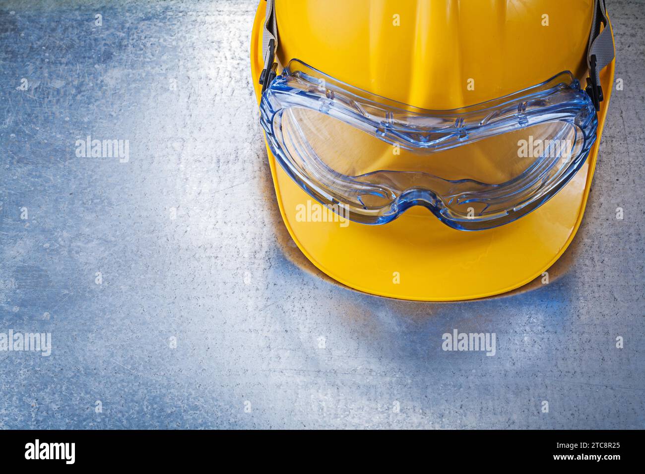 Plastic goggles building helmet on metallic background Stock Photo - Alamy