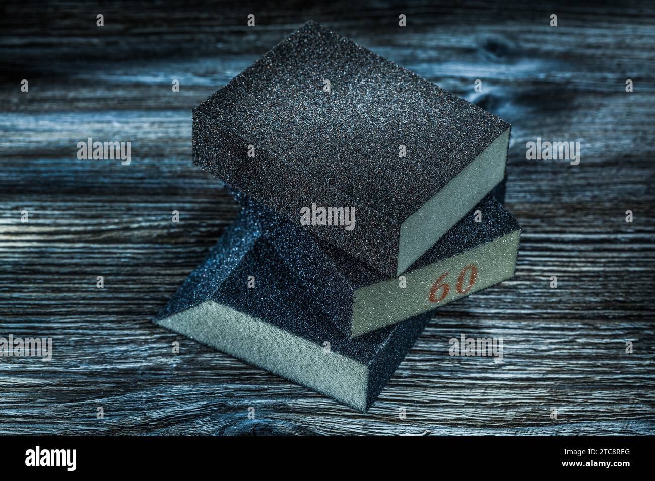Sanding blocks on an old wooden board Stock Photo - Alamy