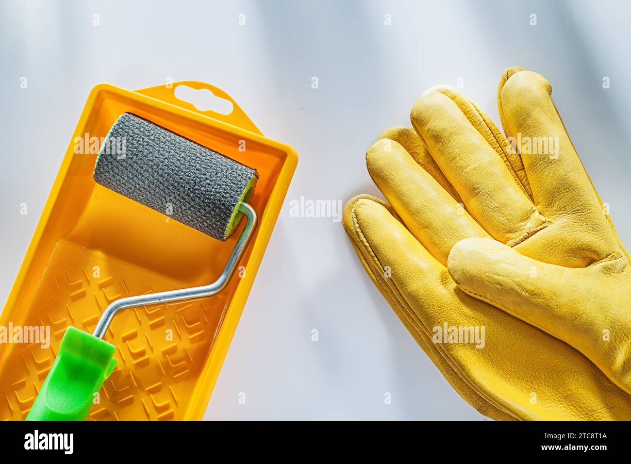 Yellow safety gloves paint hi-res stock photography and images - Alamy
