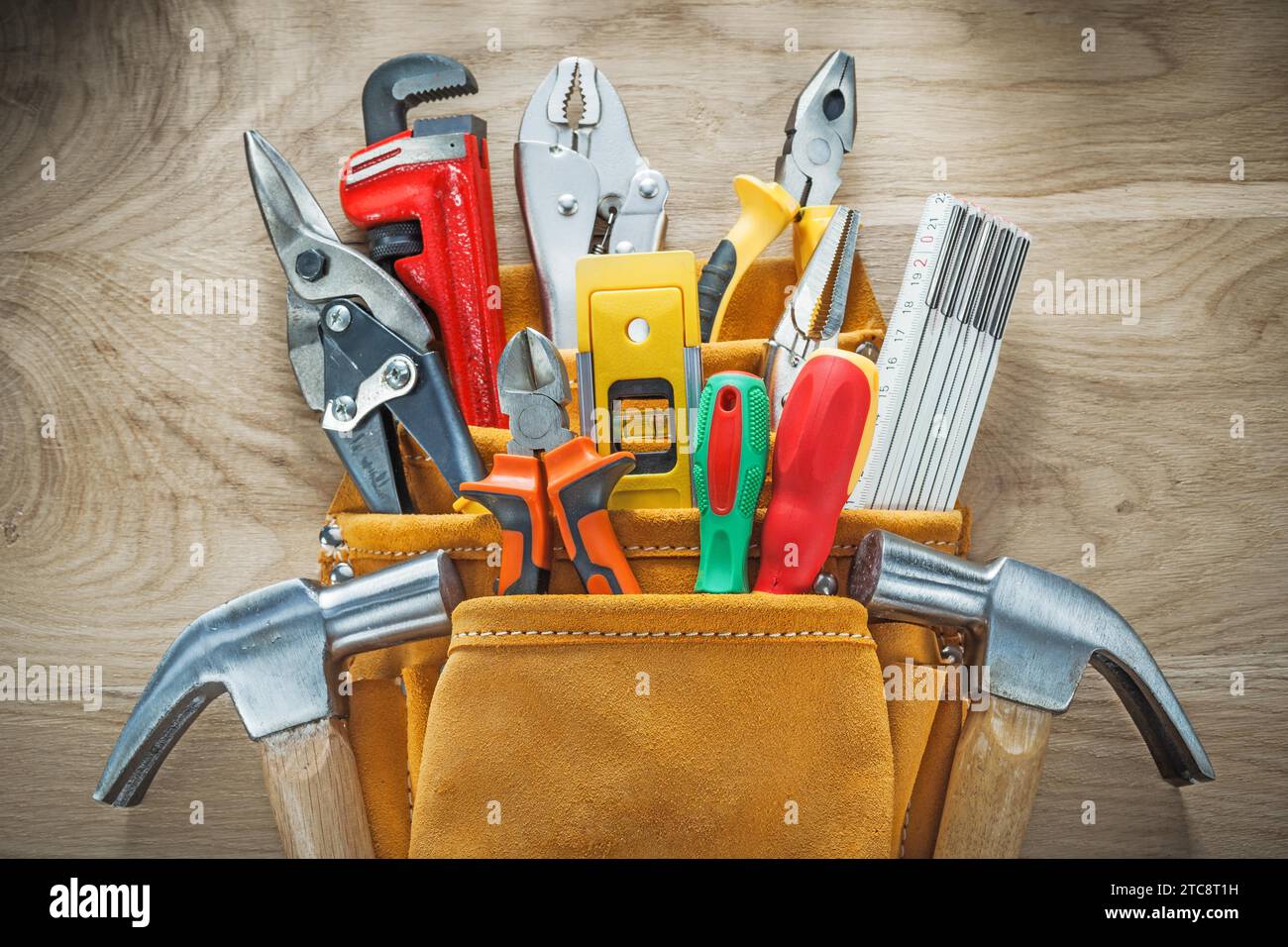 Tool set in leather construction belt on wooden board Stock Photo - Alamy