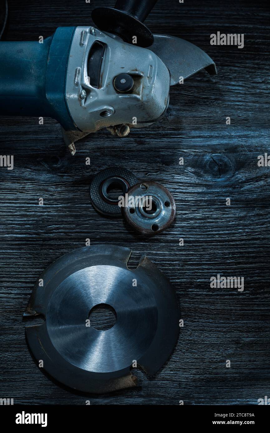 Angle grinder with rotating sanding disc on old wooden board Stock ...