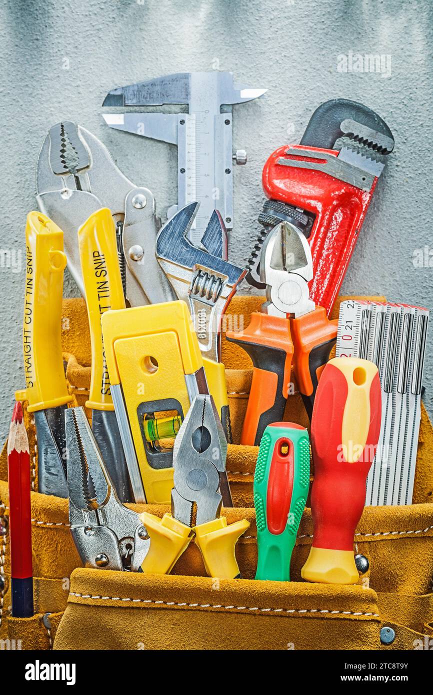 Range of construction tools in the tool belt Stock Photo - Alamy