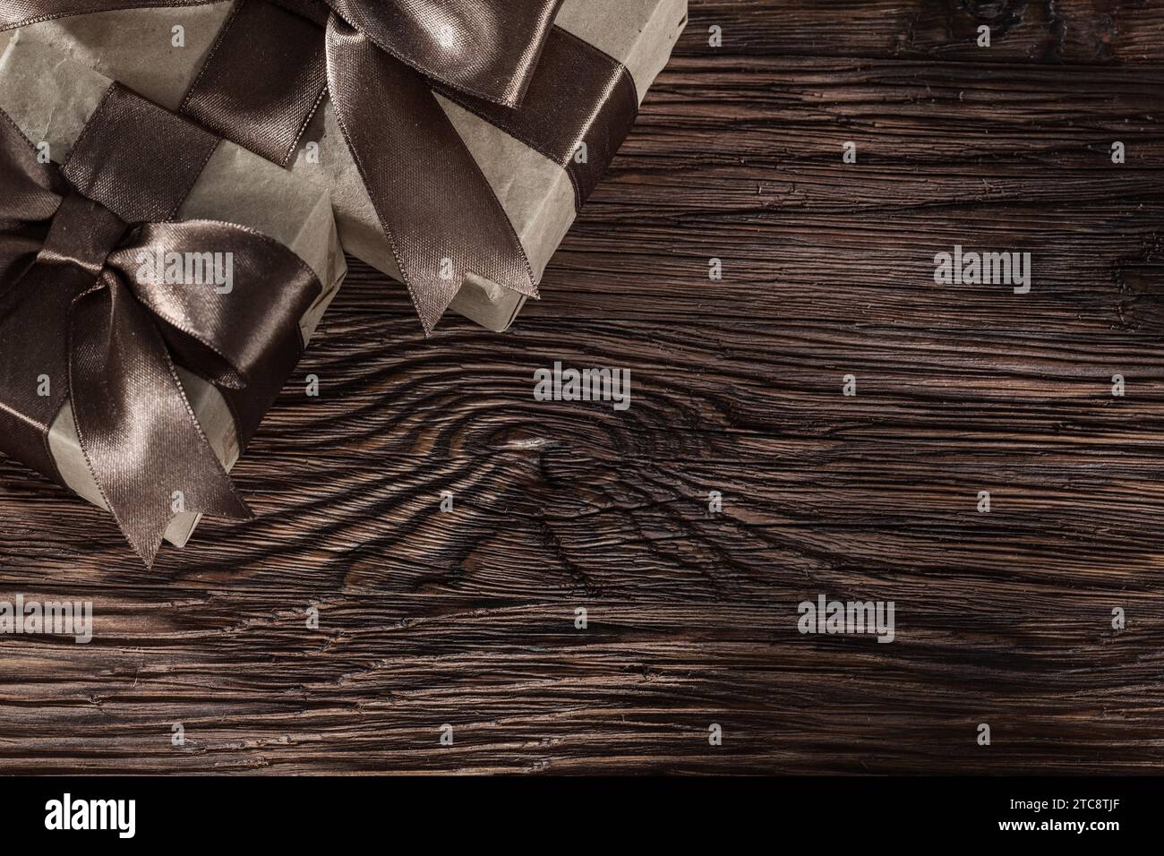 Brown gift box with knots on vintage cardboard Stock Photo - Alamy