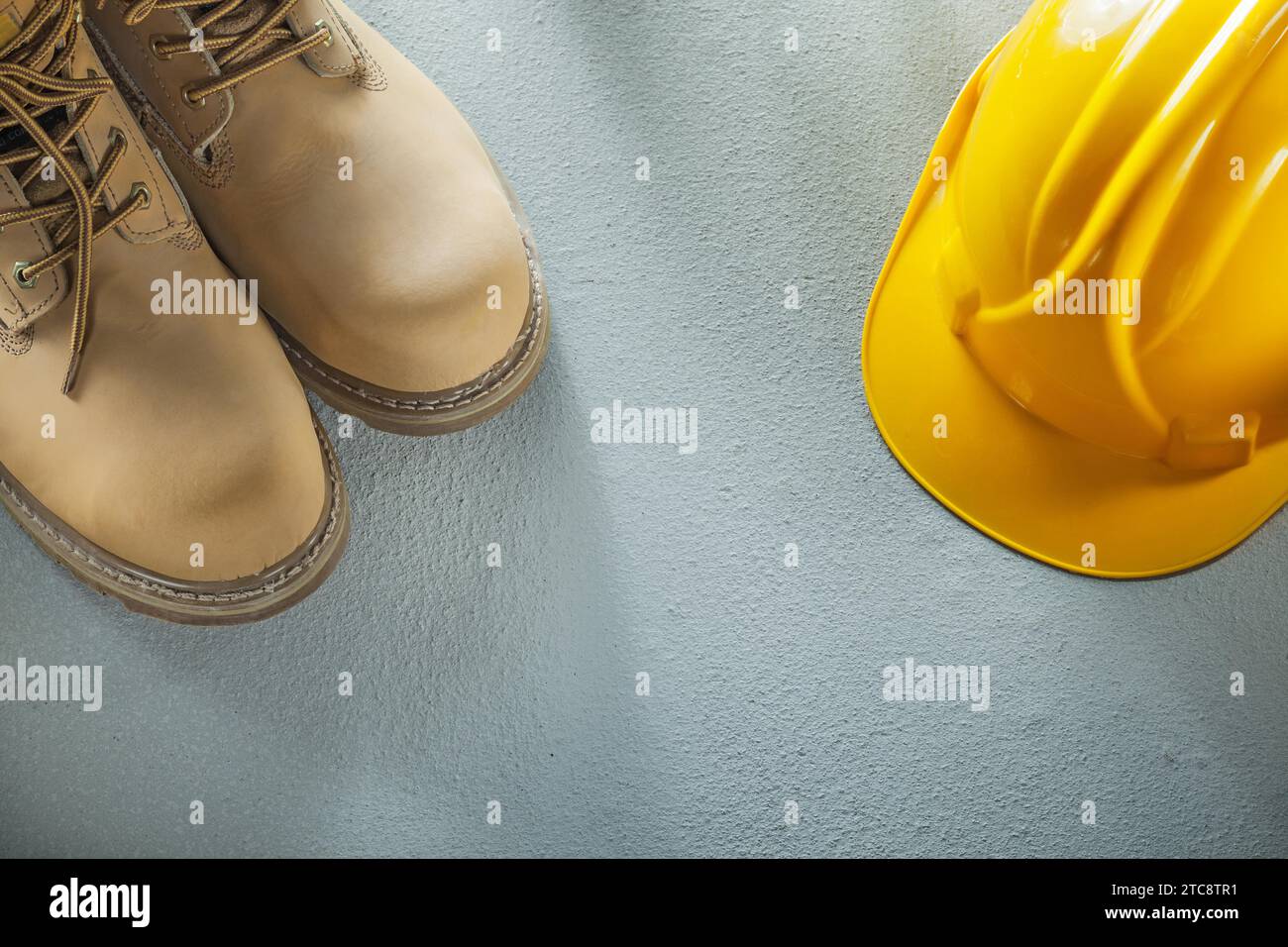 Building helmet safety boots on concrete background Stock Photo - Alamy