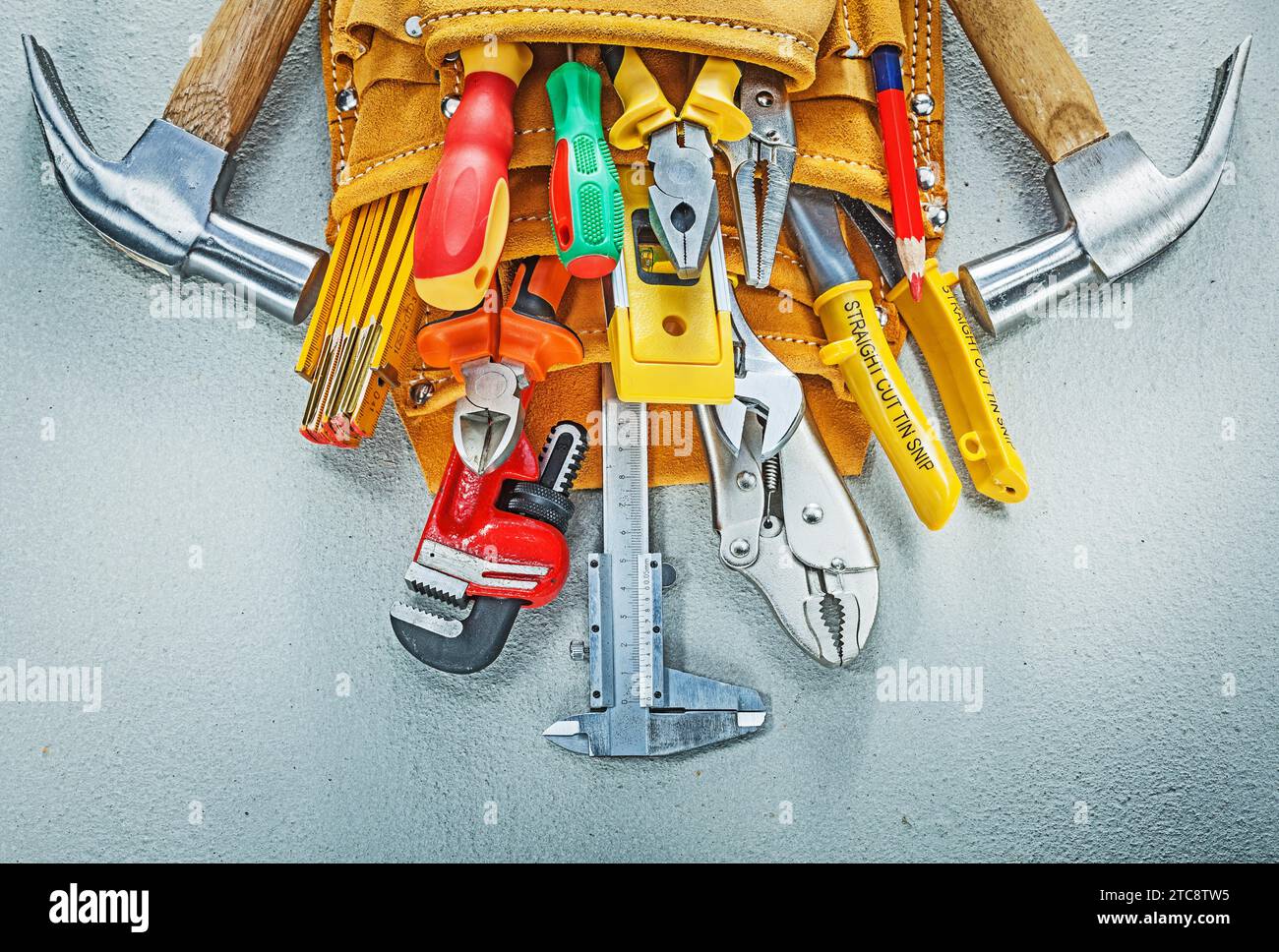 Building belt construction tools on concrete background Stock Photo - Alamy