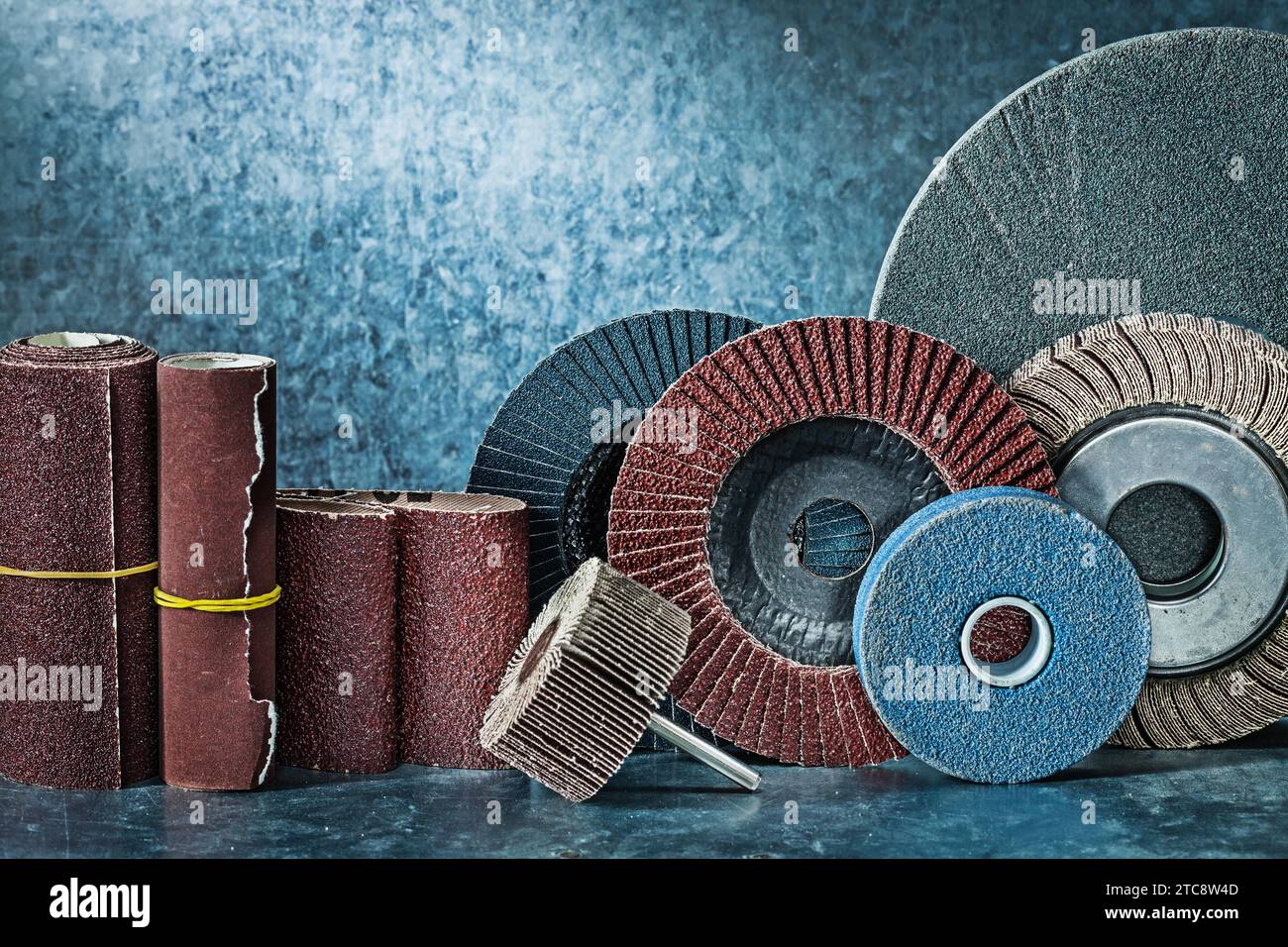 Large set of grinding tools on a metallic background Stock Photo - Alamy