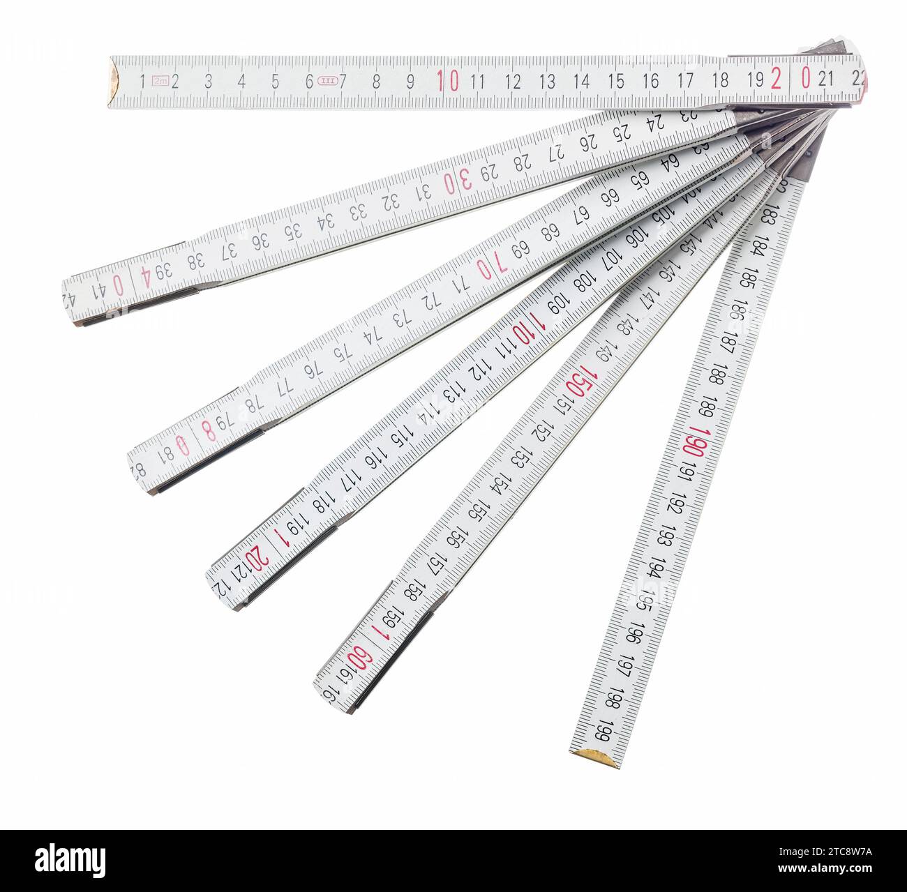 Construction wood metre in front of white background Stock Photo - Alamy