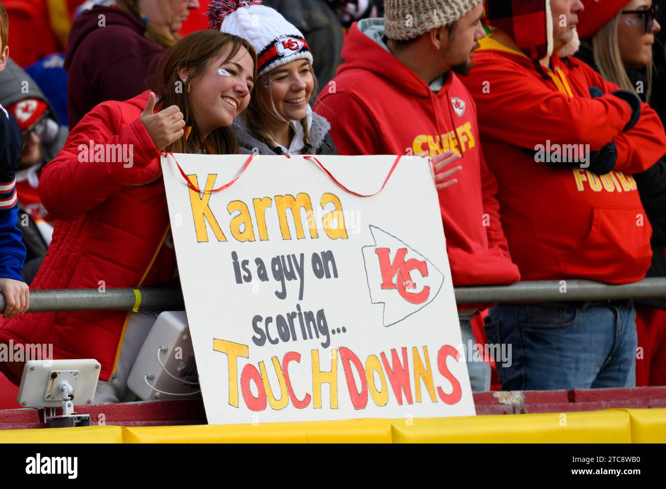 Two Kansas City Chiefs fans hold a sign referencing Taylor Swift's song ...