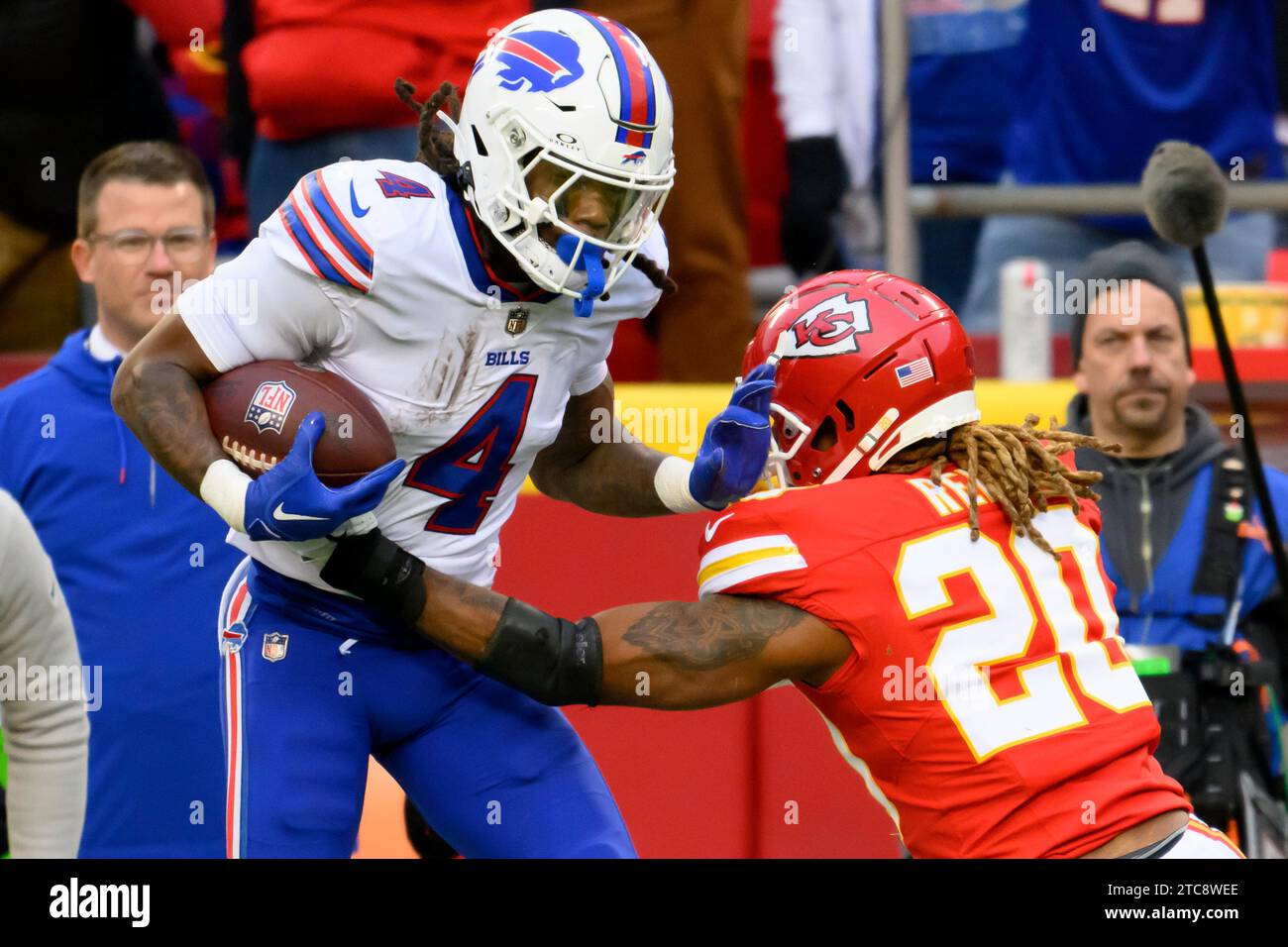 Buffalo Bills running back James Cook (4) is tackled by Kansas City ...