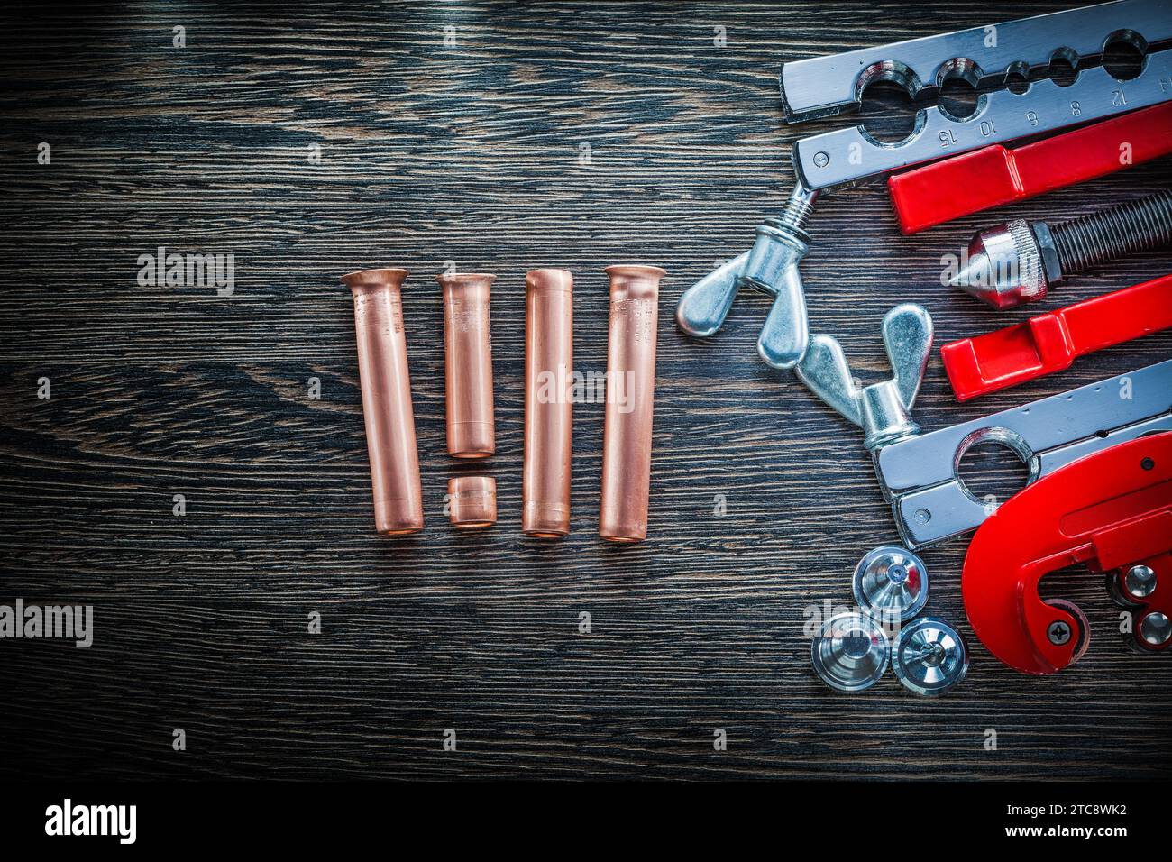 Tools for flaring gas pipes on a wooden board Stock Photo - Alamy