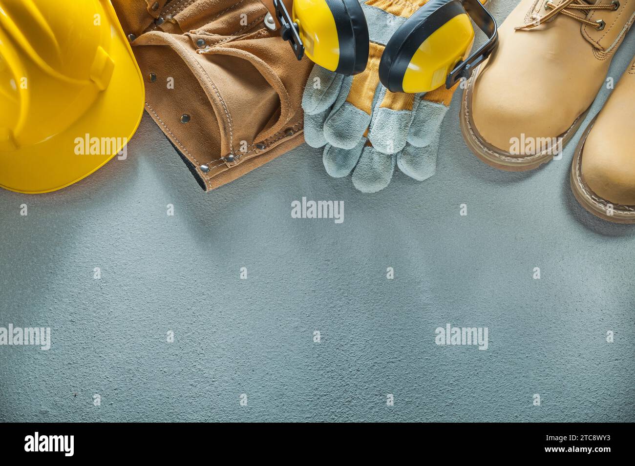 Safety helmet Tool belt Protective gloves Boots Hearing protection on ...