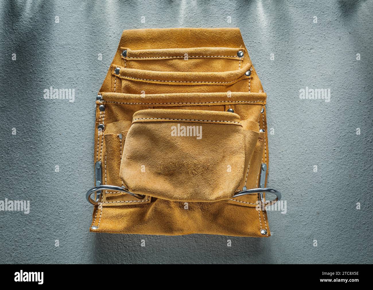 Leather construction belt on a concrete background Stock Photo - Alamy