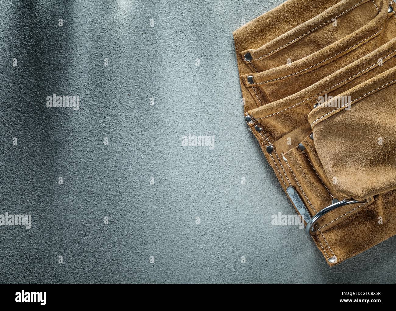 Leather building belt on a concrete background Stock Photo - Alamy
