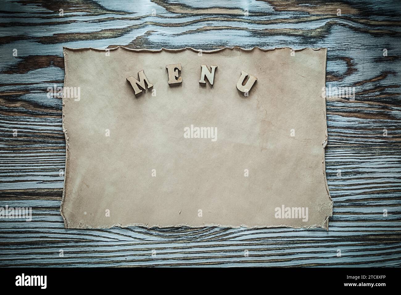 Vintage roll menu on wooden board Stock Photo - Alamy