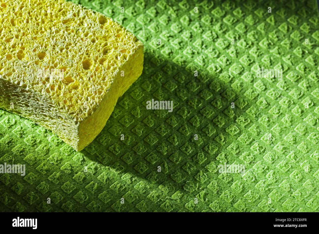 New kitchen sponge on flannel Stock Photo - Alamy