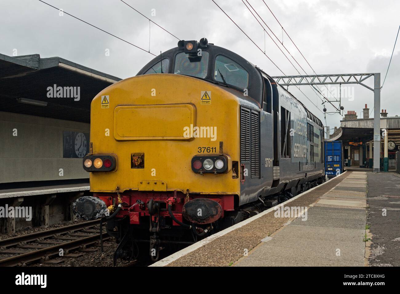 37611 heading a freight train through Carnforth railway station Stock ...