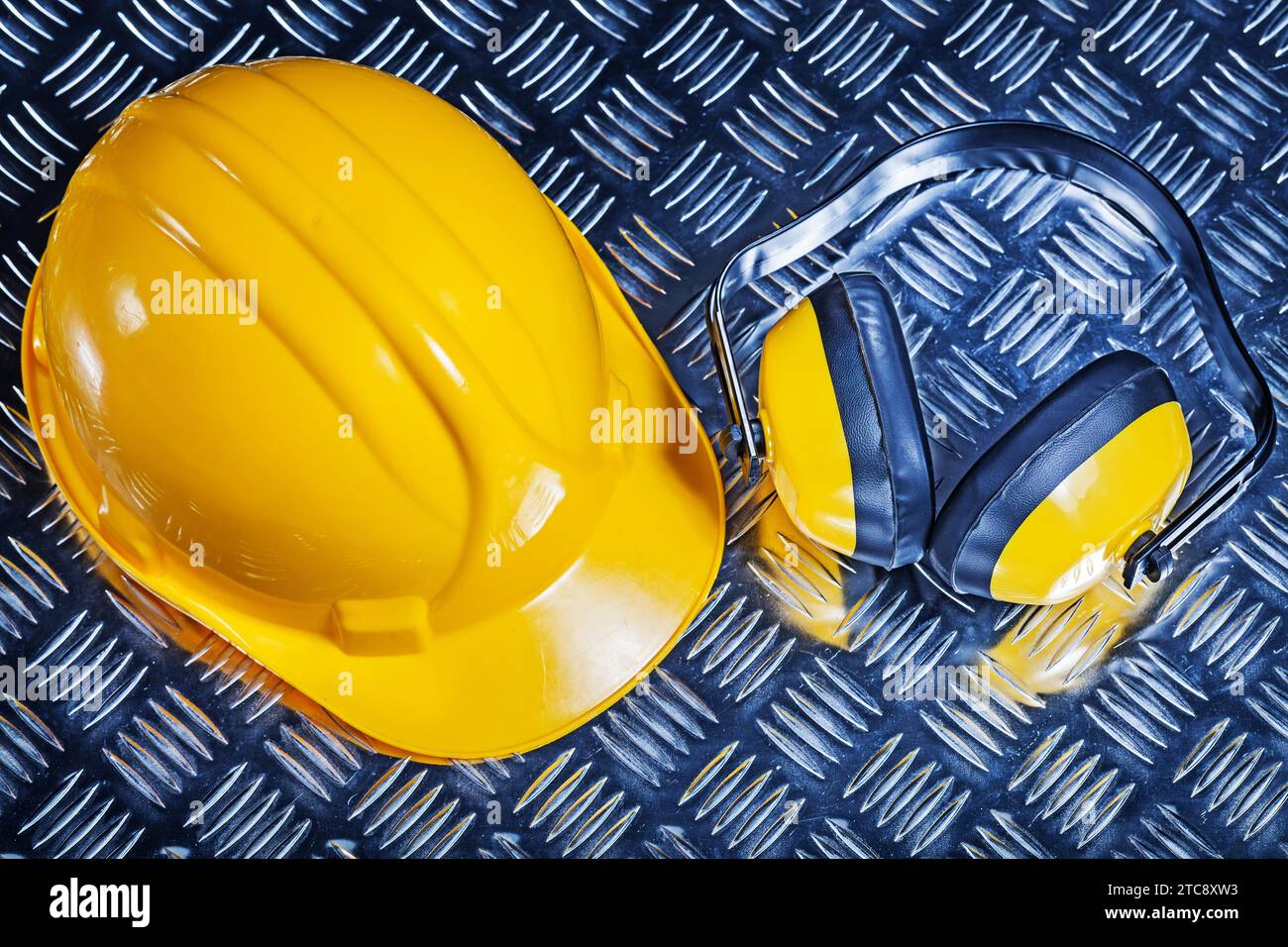 Headphones and helmet on corrugated metal sheet Stock Photo - Alamy