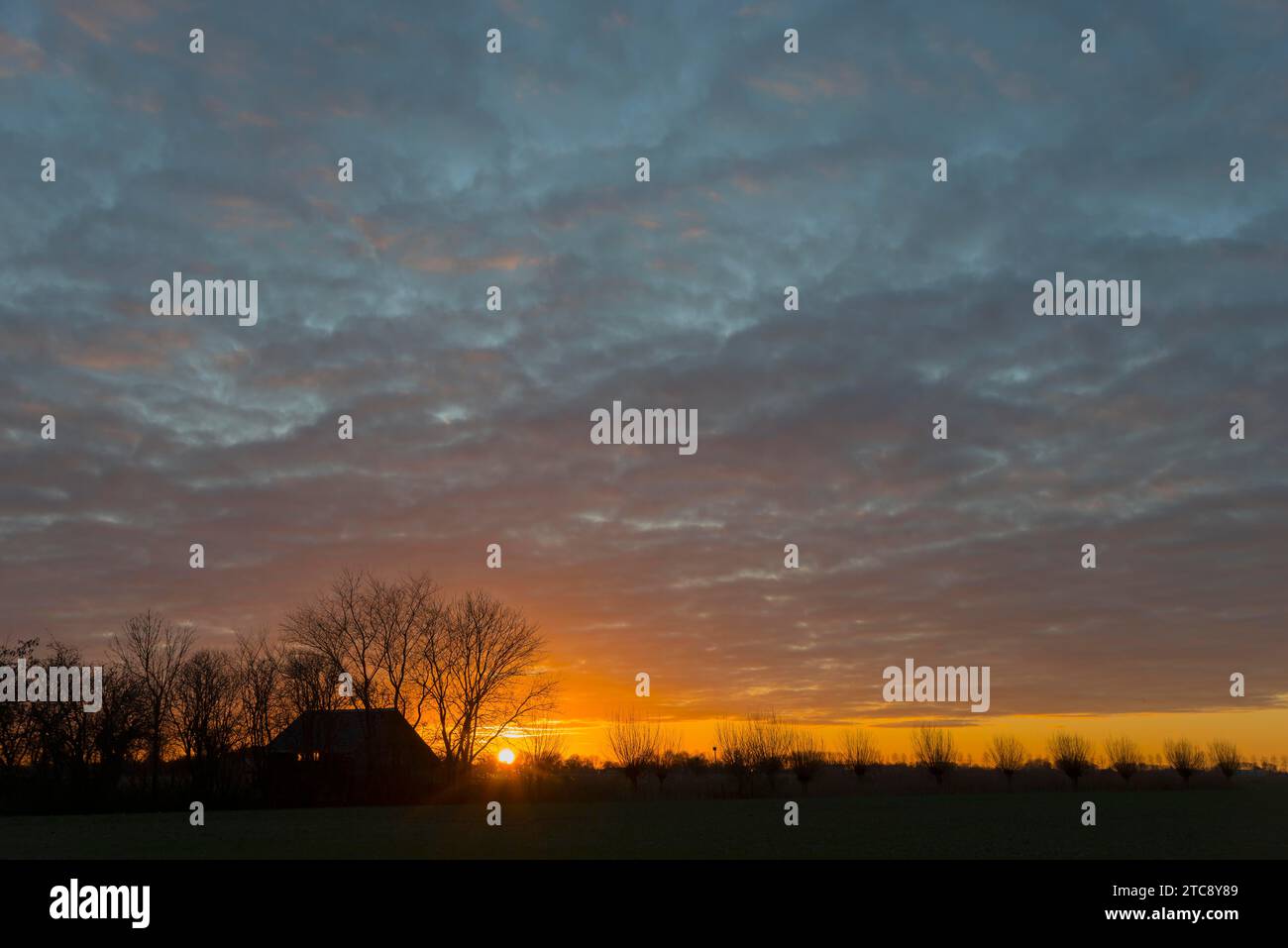 Sunset, sky on fire, house on the Dijkweg, Holwierde, Eemsdelta ...
