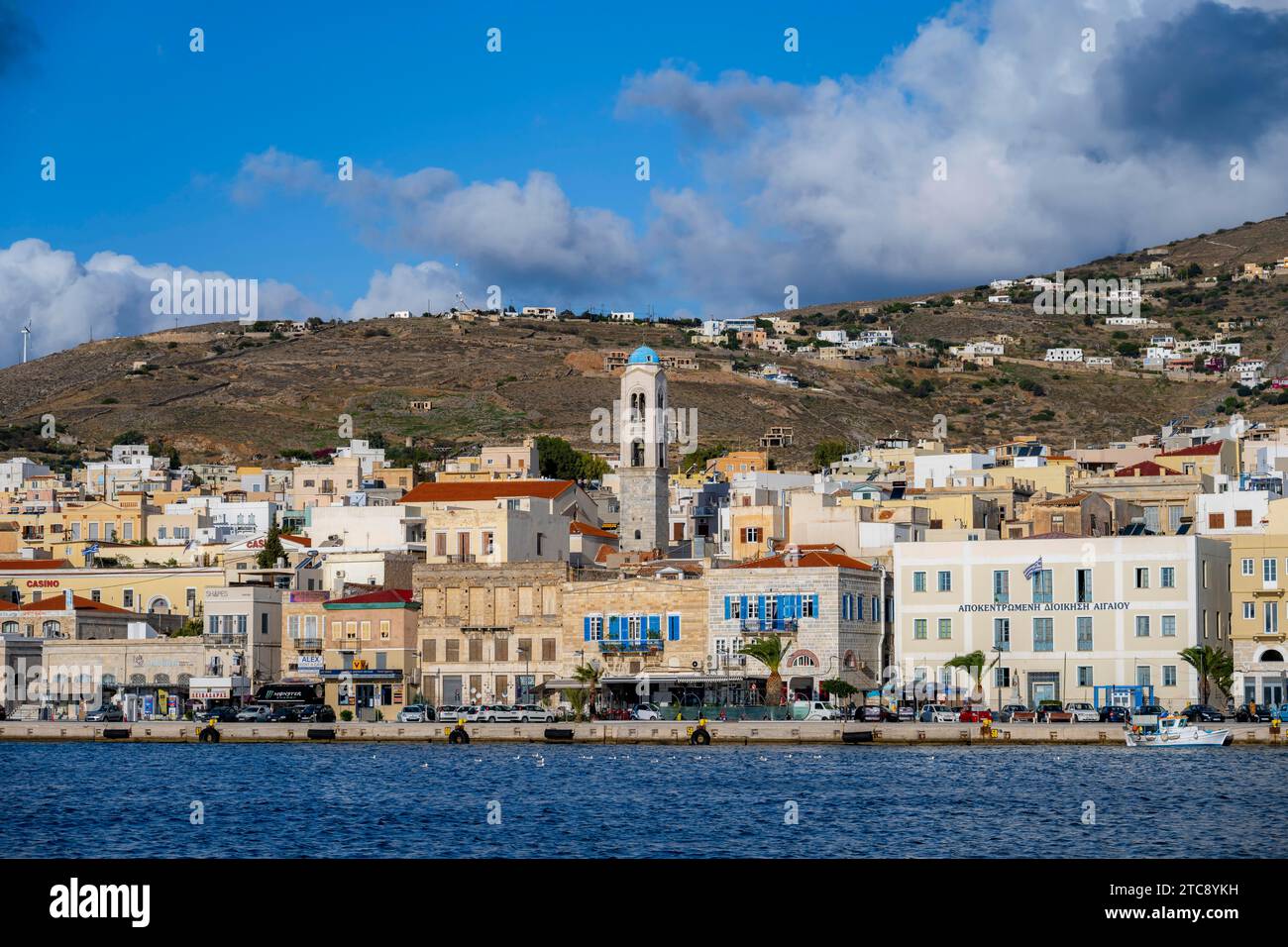 View of the town of Ermoupoli with pastel-coloured houses and sea ...
