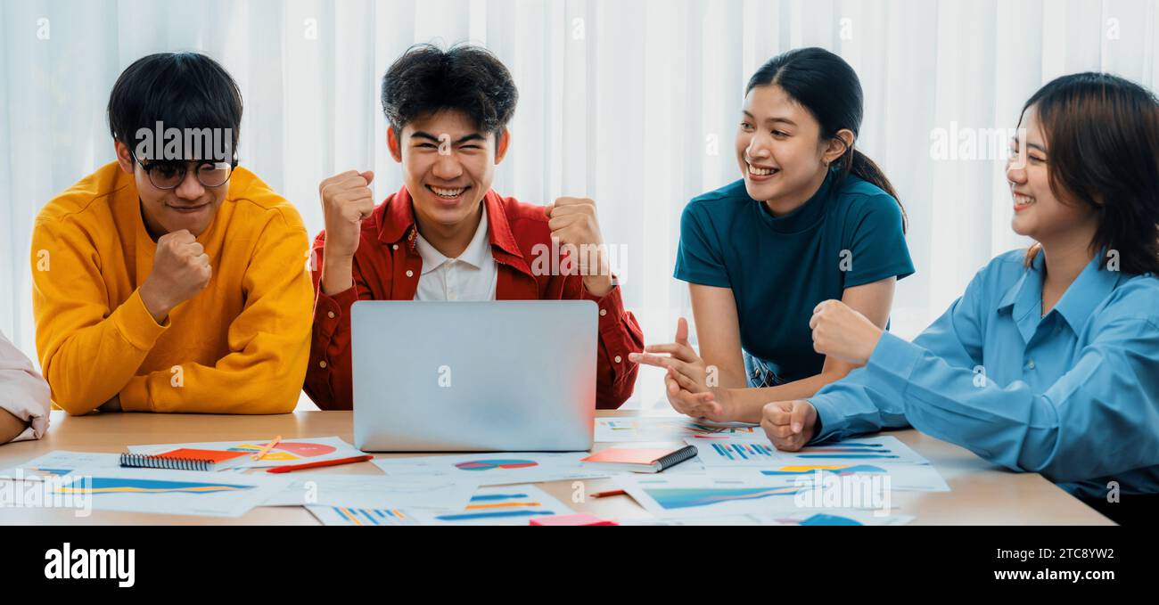 Excited and happy startup company employee celebrate after make ...