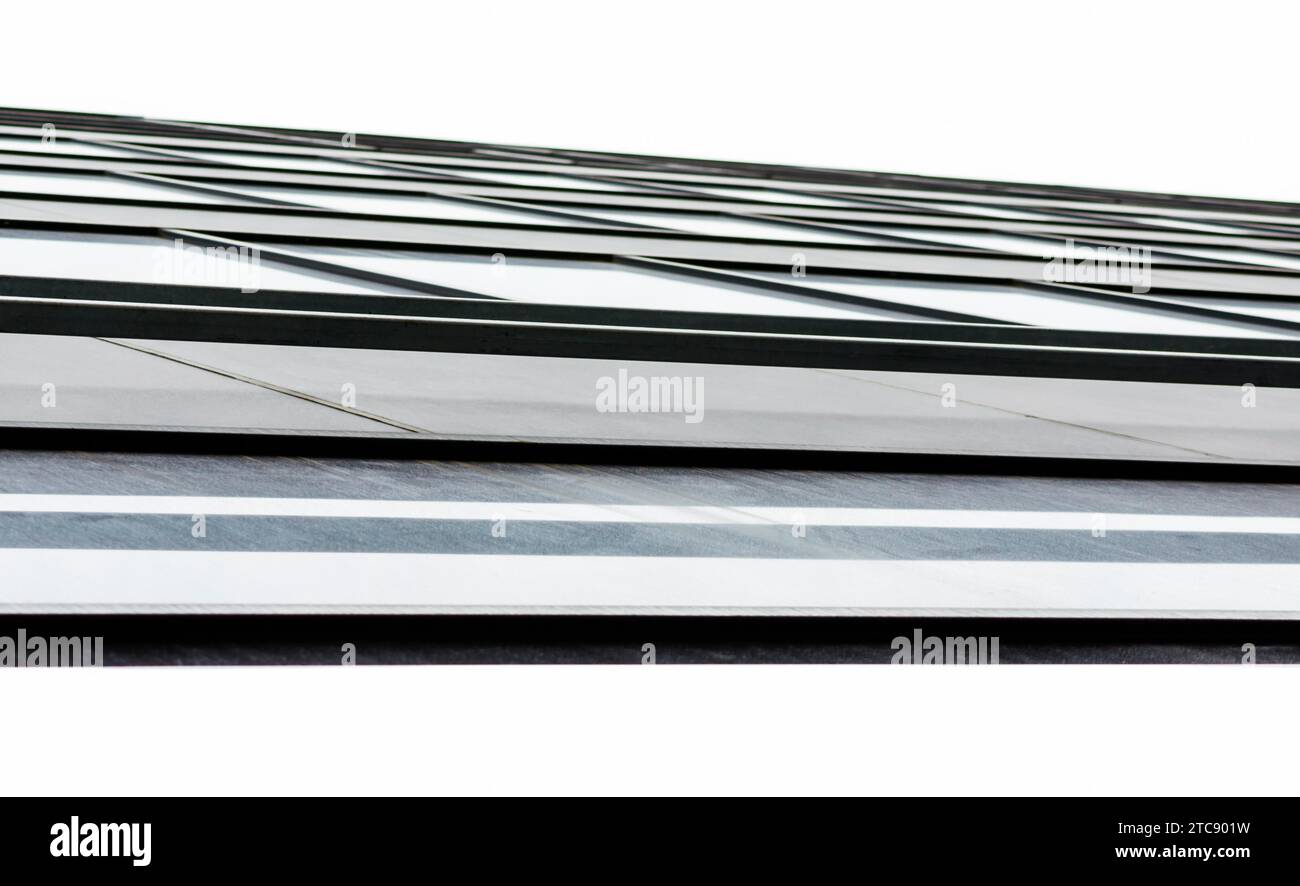 Fragment of the wall and windows of a modern tall office building ...