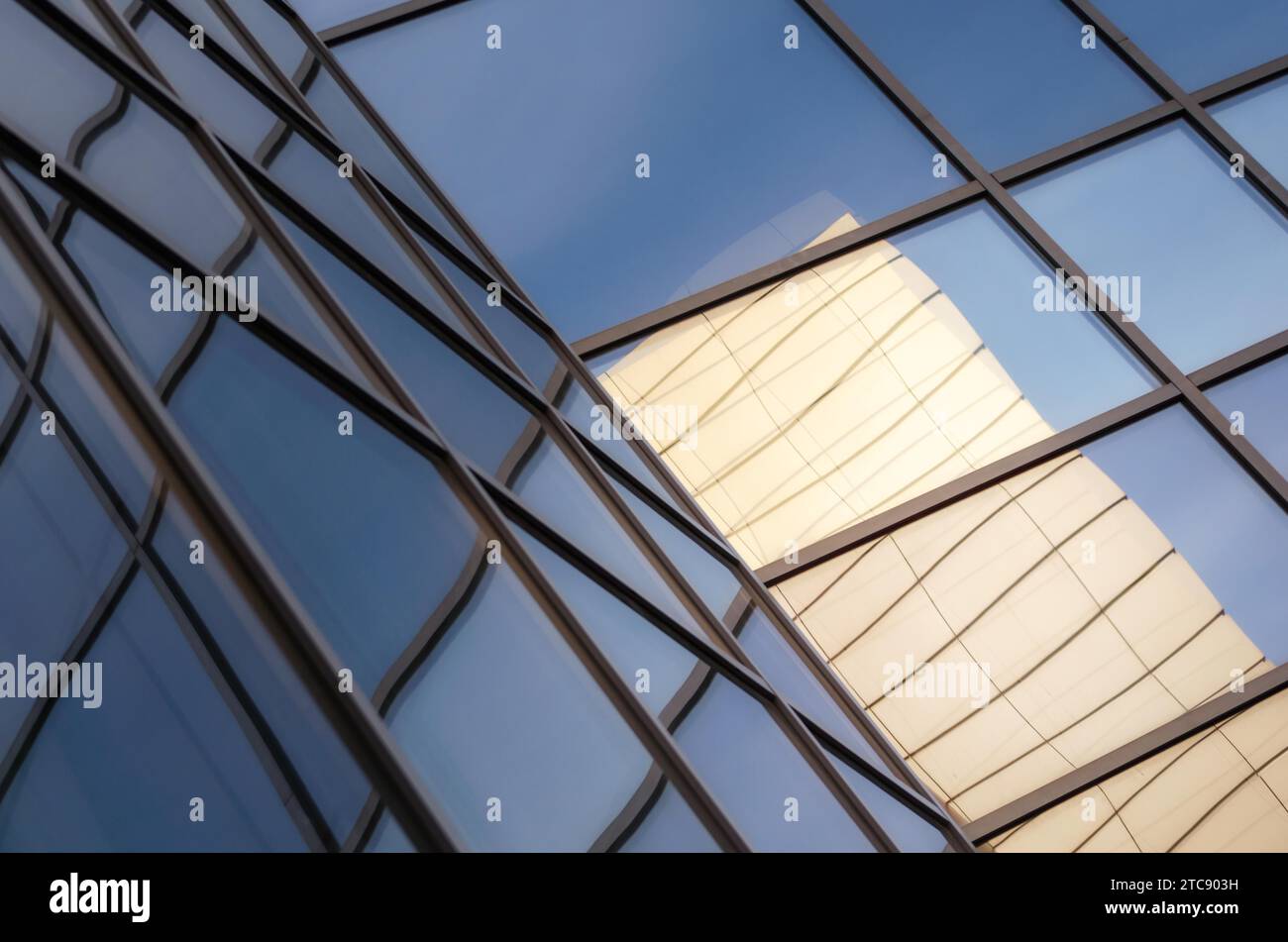 Reflection with distortion in the window of a modern building color ...