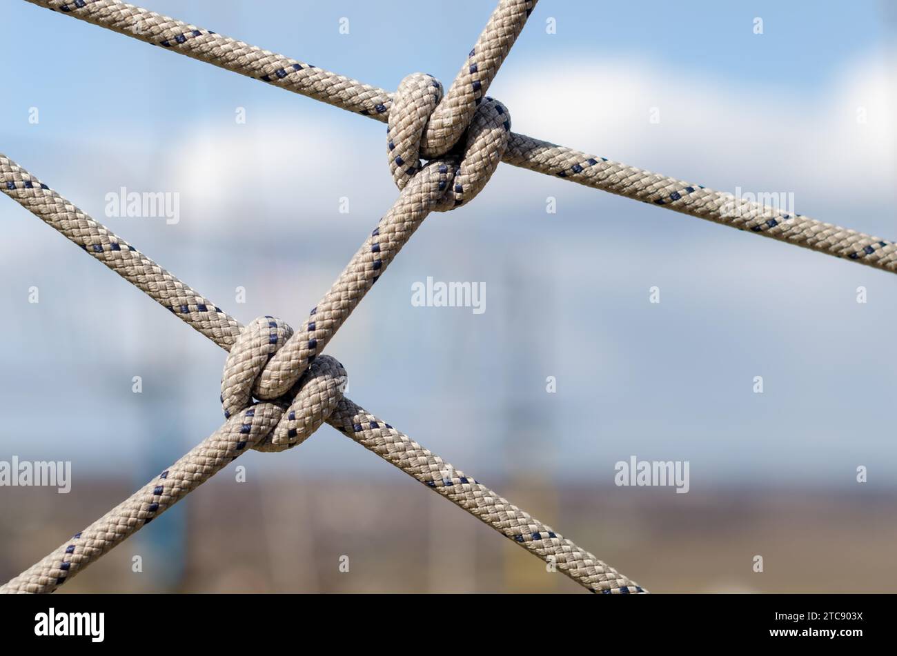 Many ropes and one big knot black and white abstract background close ...