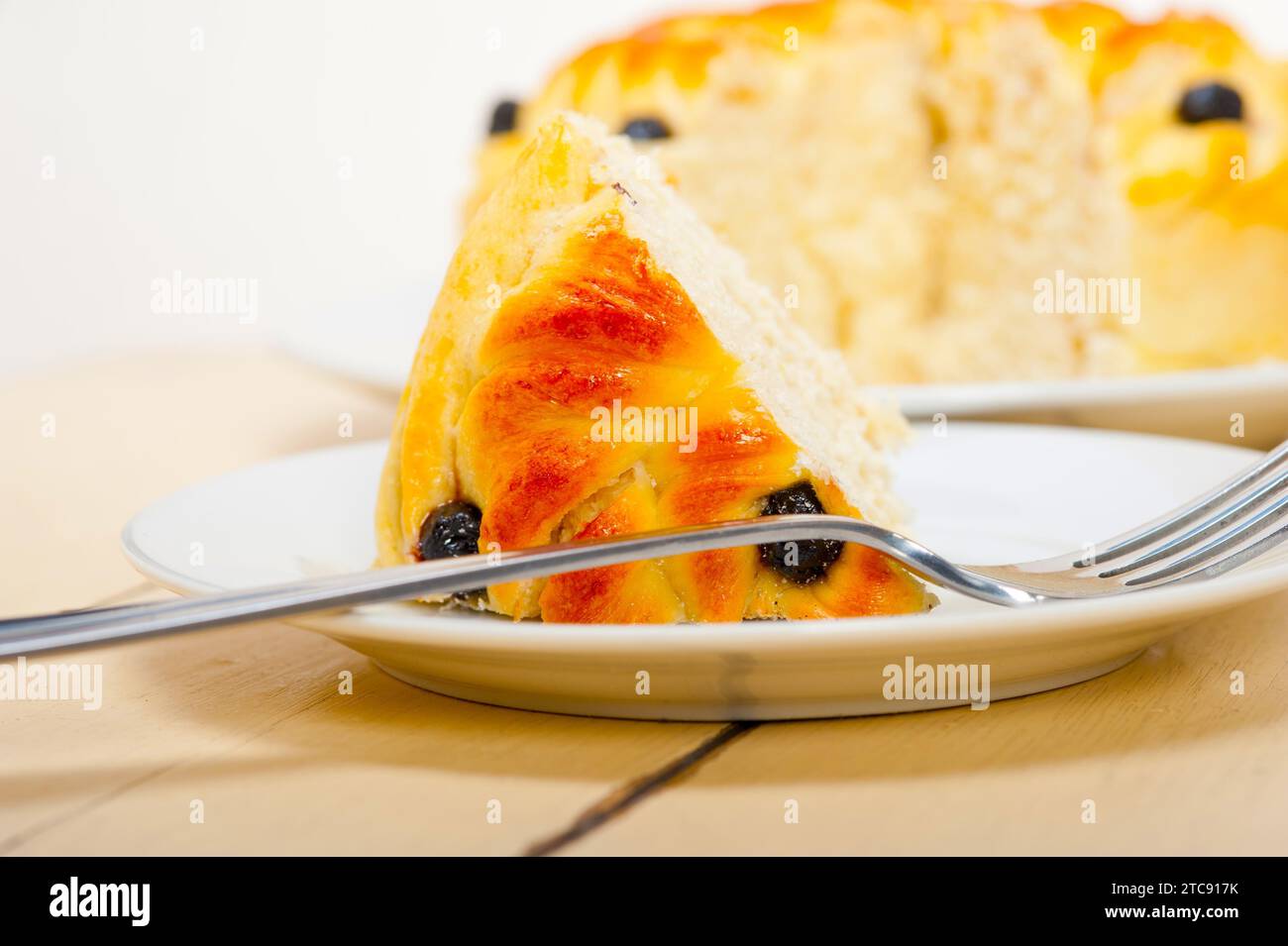 Fresh home baked blueberry bread cake dessert over white wood table ...