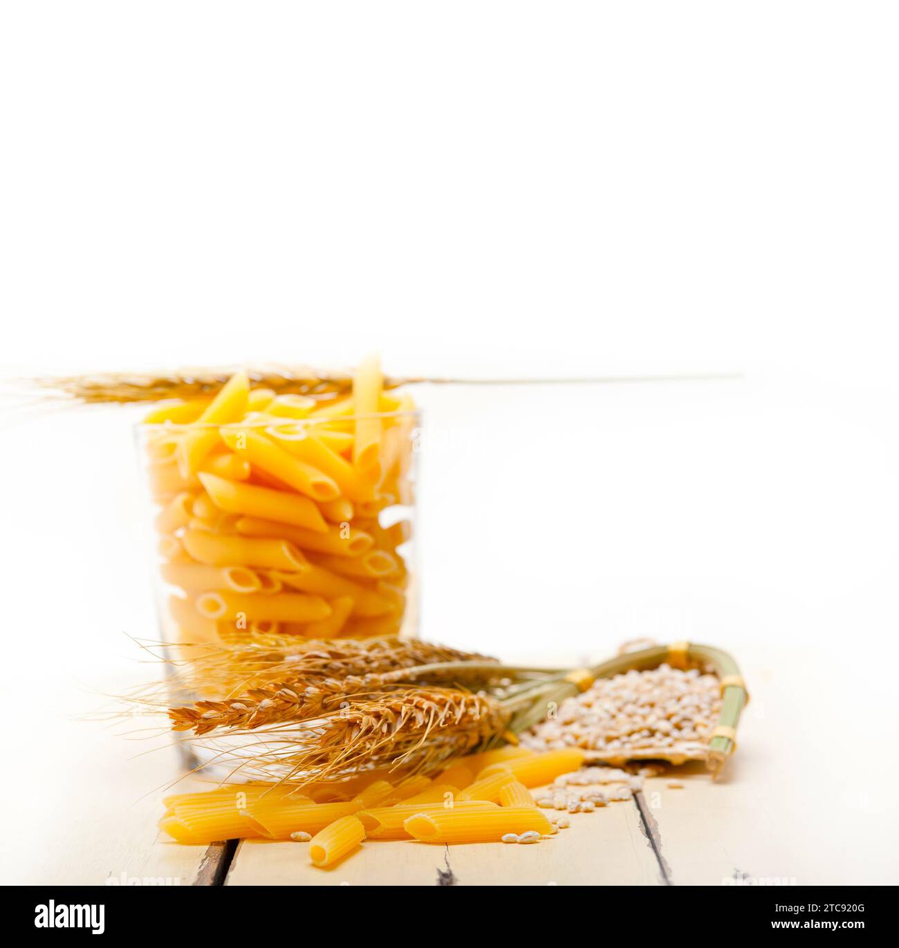 Short Italian pasta penne with durum wheat grains Stock Photo - Alamy