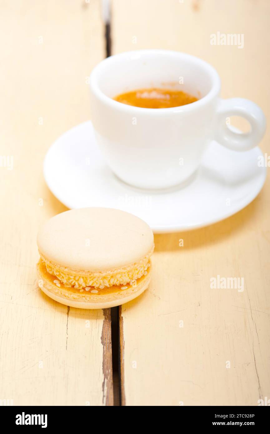 Colorful macaroons with espresso coffee over white wood table Stock ...