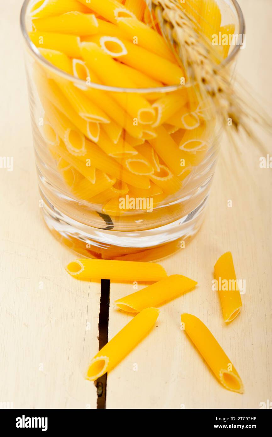 Short Italian pasta penne with durum wheat grains Stock Photo - Alamy