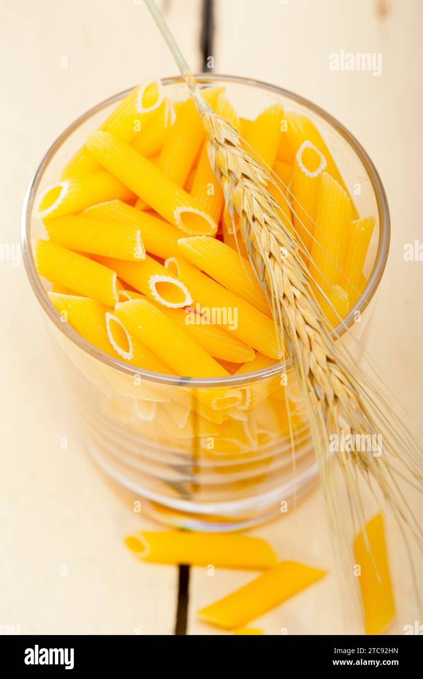 Short Italian pasta penne with durum wheat grains Stock Photo - Alamy