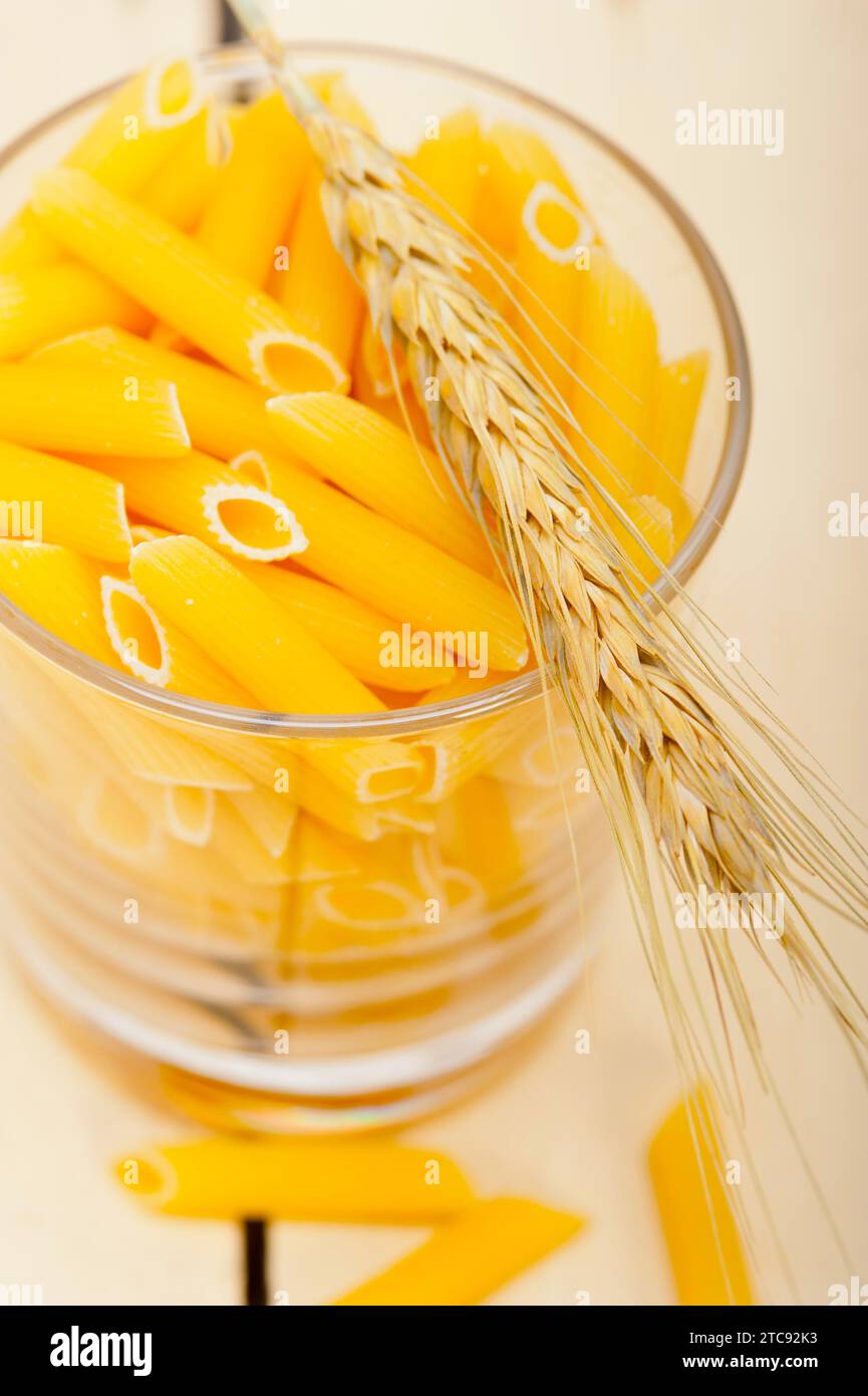 Short Italian pasta penne with durum wheat grains Stock Photo - Alamy