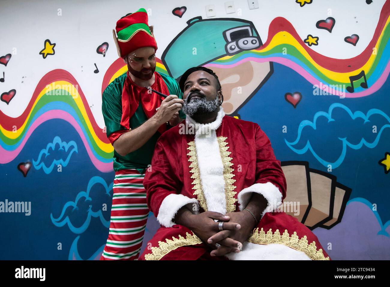 Actor Rodrigo Franca gets dressed up as "Papai Negro" or Black Santa, for a school Christmas ...