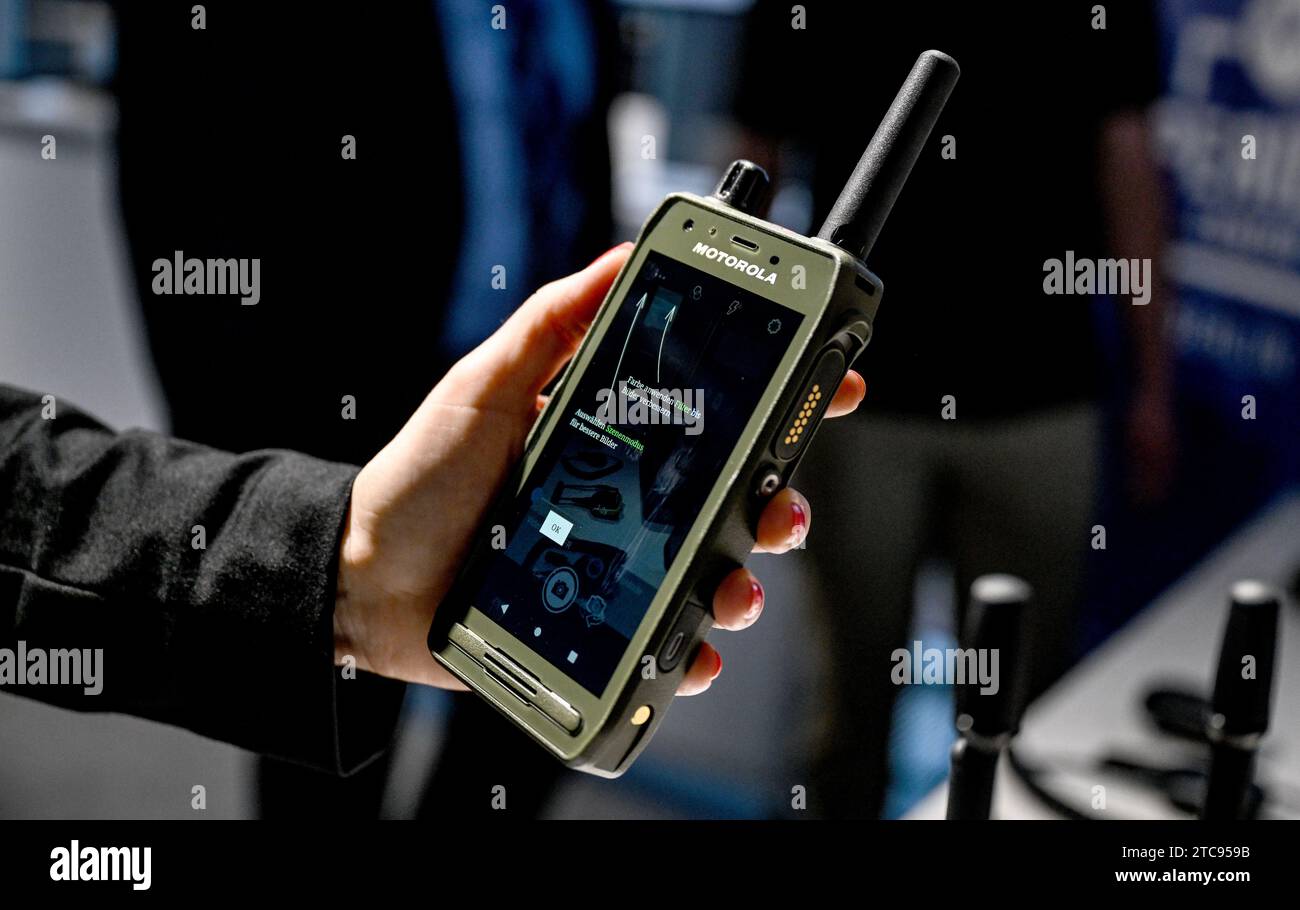 Berlin, Germany. 11th Dec, 2023. A young woman shows the LTE-capable ...