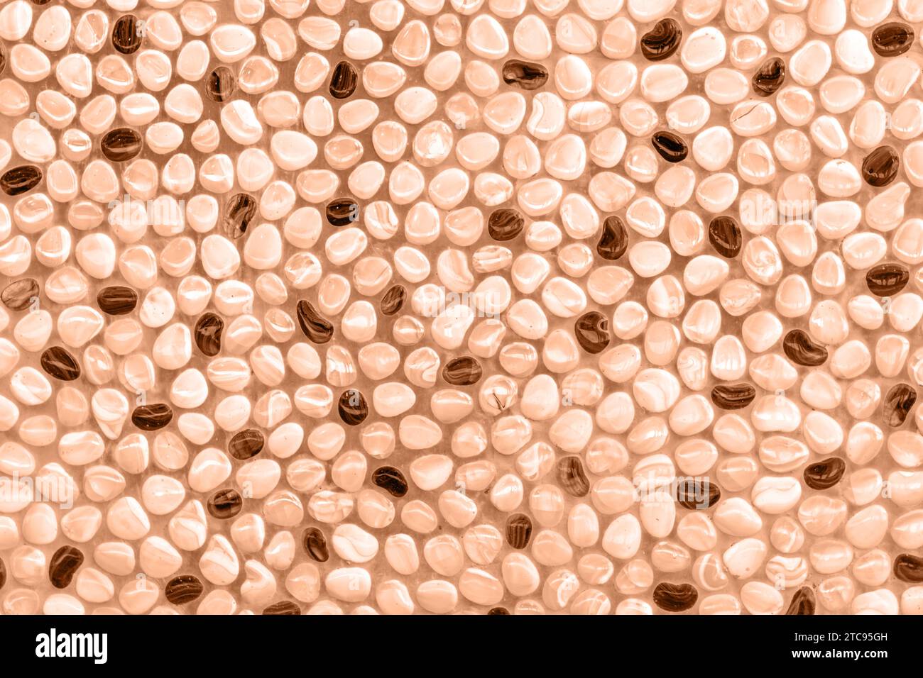 Polished pebbles background. Color of the Year 2024 Peach Fuzz Stock ...